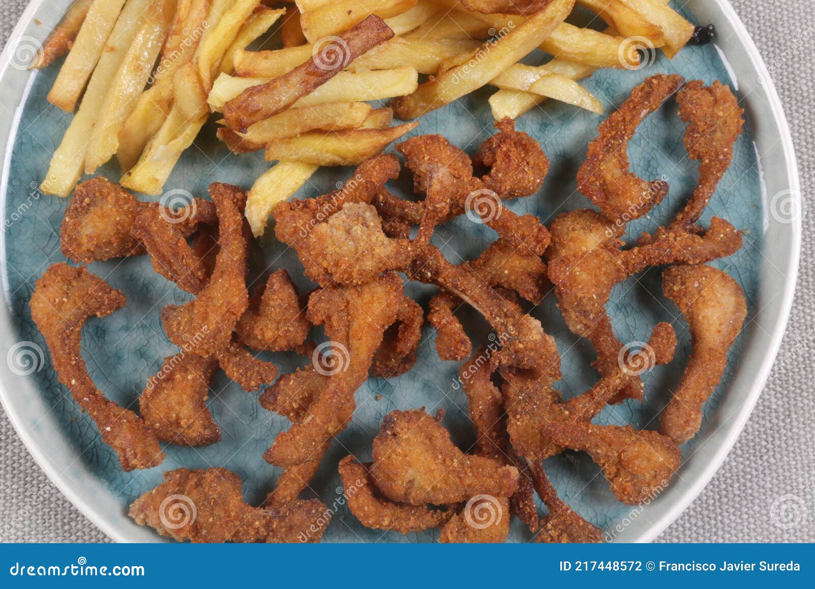 Breaded Rabbit Ribs with Fried Potatoes Stock Photo - Image of potatoes ...