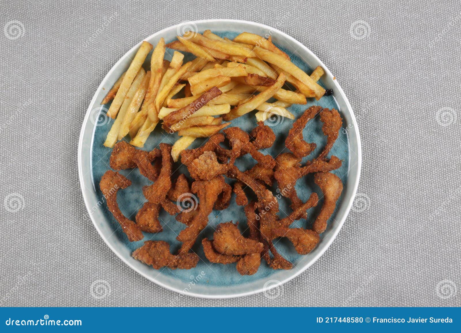 Breaded Rabbit Ribs with Fried Potatoes Stock Photo - Image of meat ...