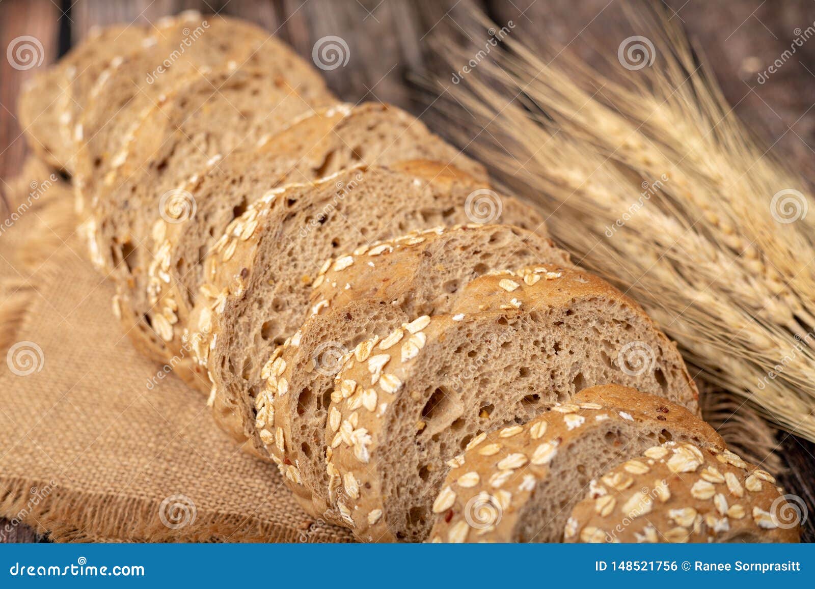 Breads Sliced and Wheatgrass on the Sack Stock Photo - Image of bread ...