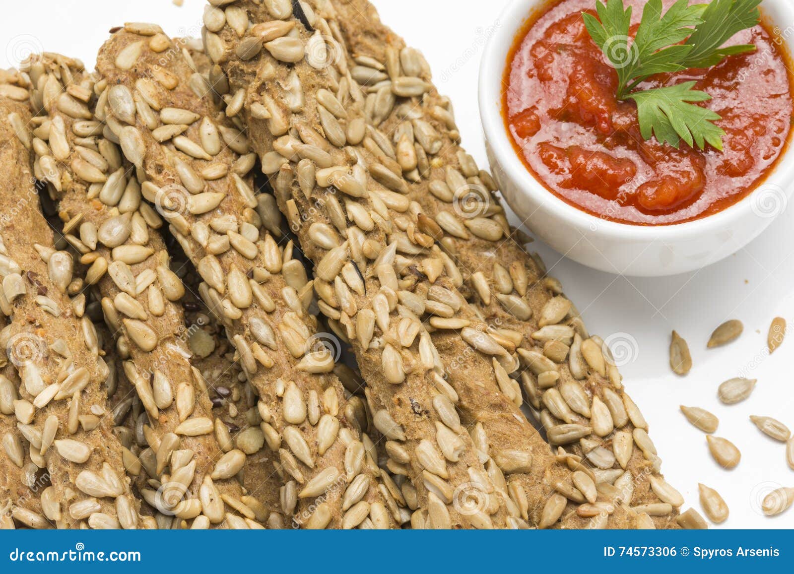 Breadsticks with Sunflower Seeds, and Red Sauce Stock Photo - Image of ...