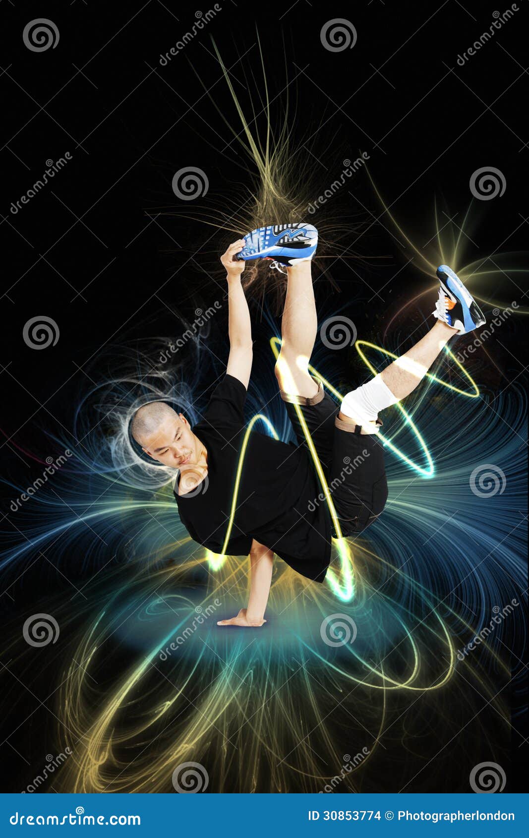 Break Dancer Performing Handstand Over Blue Background Stock Photo ...