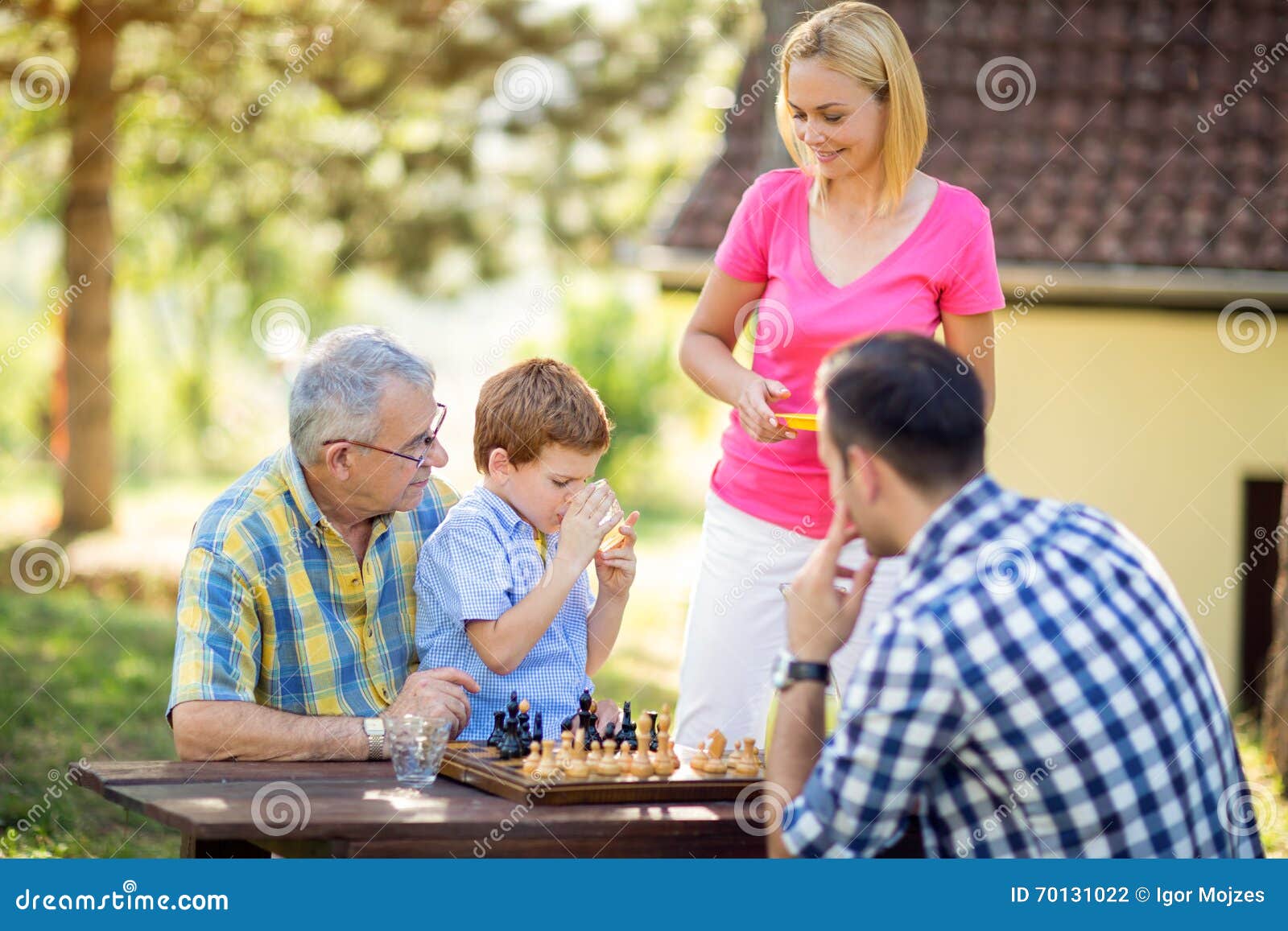 Break from a Game of Chess with Family Stock Photo - Image of game ...