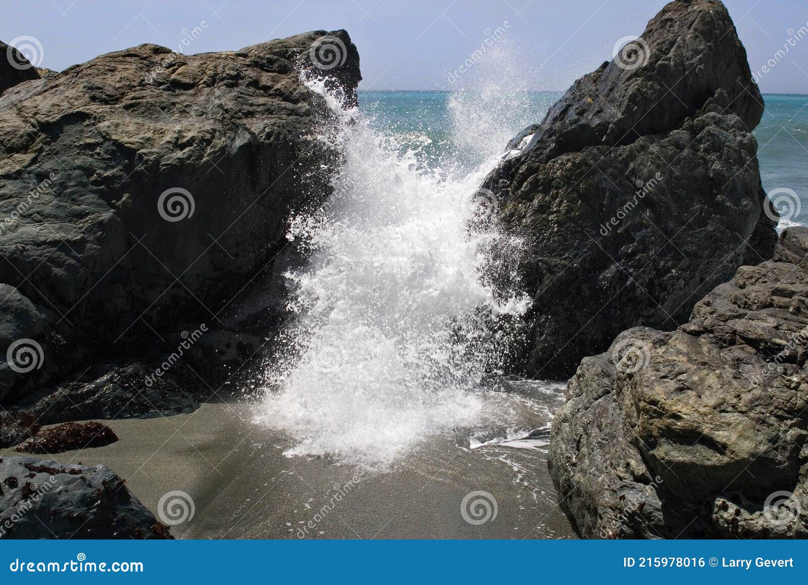 Ocean Waves Break through a Narrow Rock Fissure Stock Photo - Image of ...