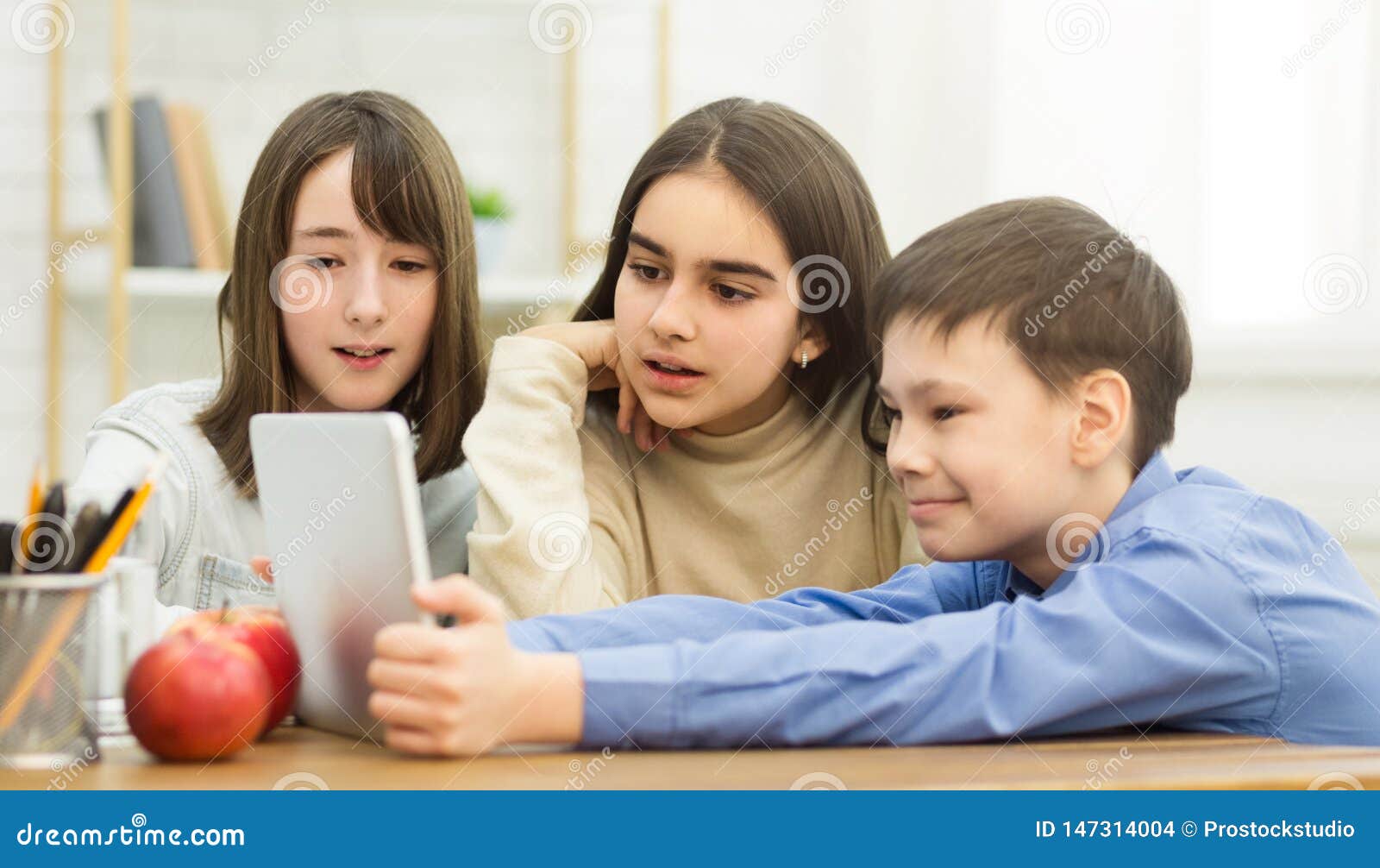 Break at School. Children Playing on Tablet Computer Stock Photo ...