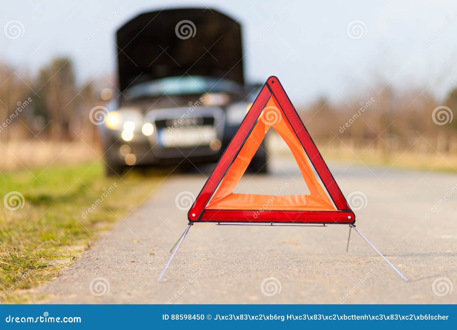 Breakdown Triangle Stands on a Broken Car Stock Photo - Image of ...