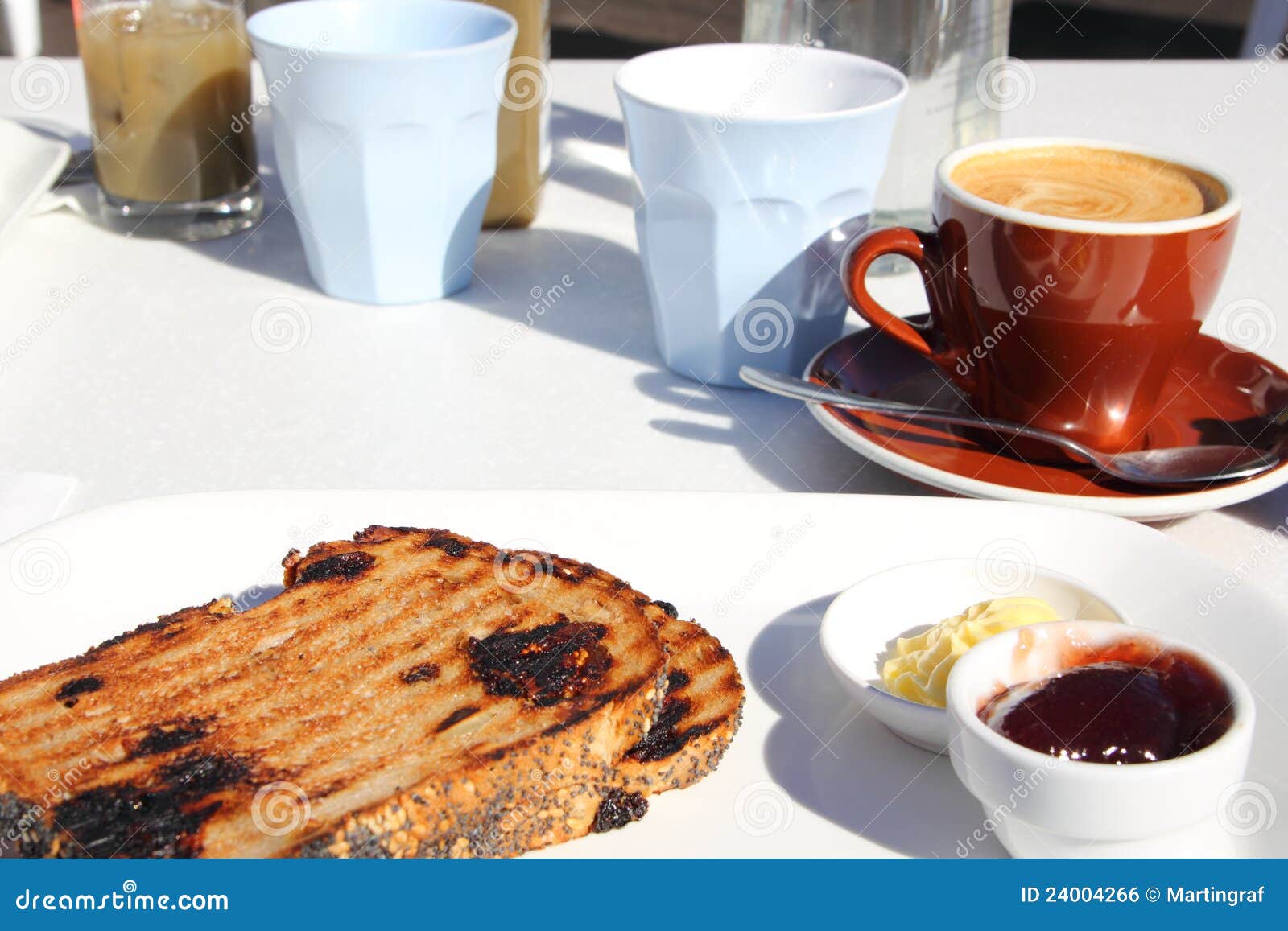 Simple Breakfast with Coffee, Toast, Butter and Jam Served Outside ...