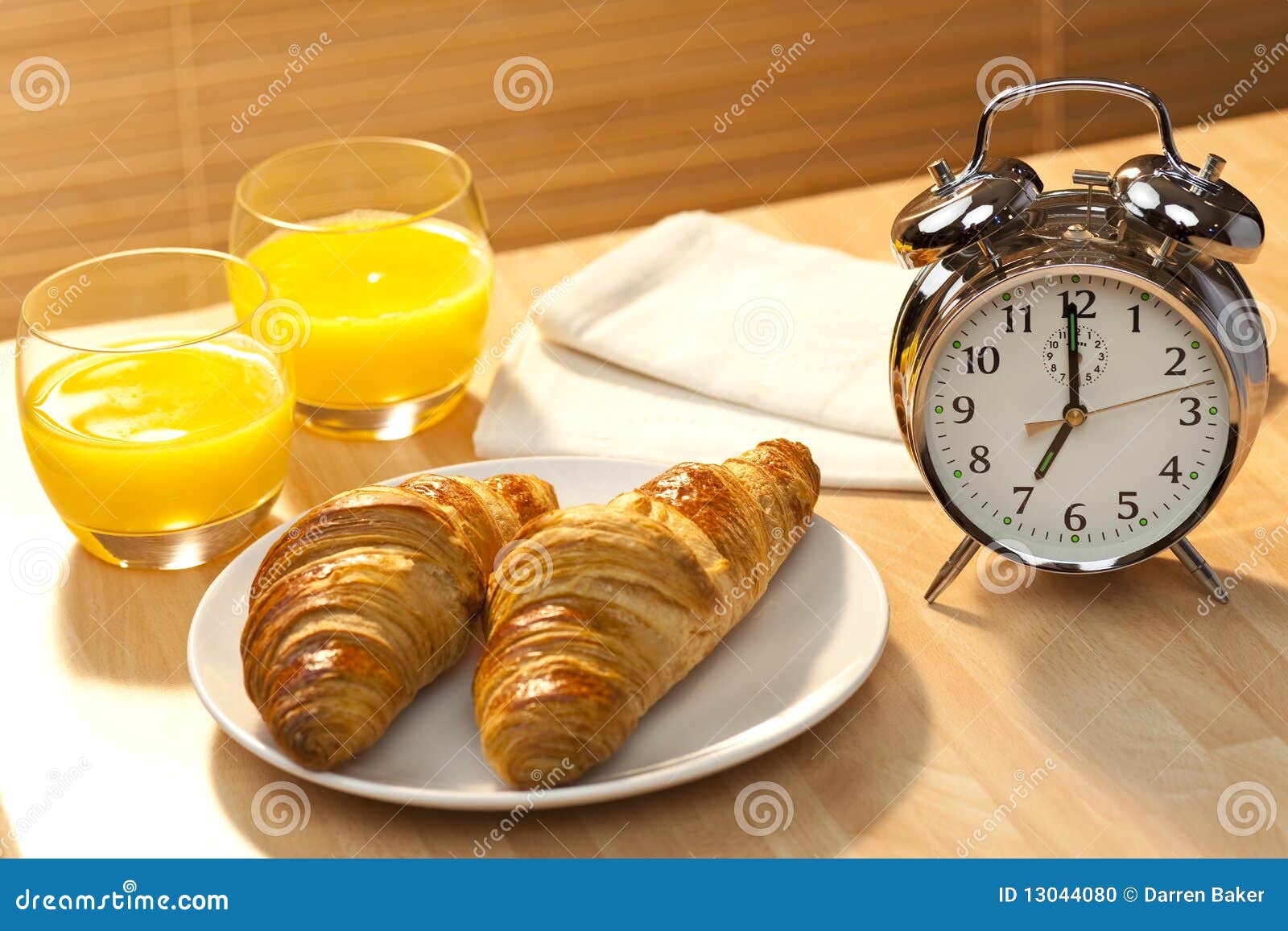 Breakfast Croissant, Orange Juice and Alarm Clock Stock Photo - Image ...