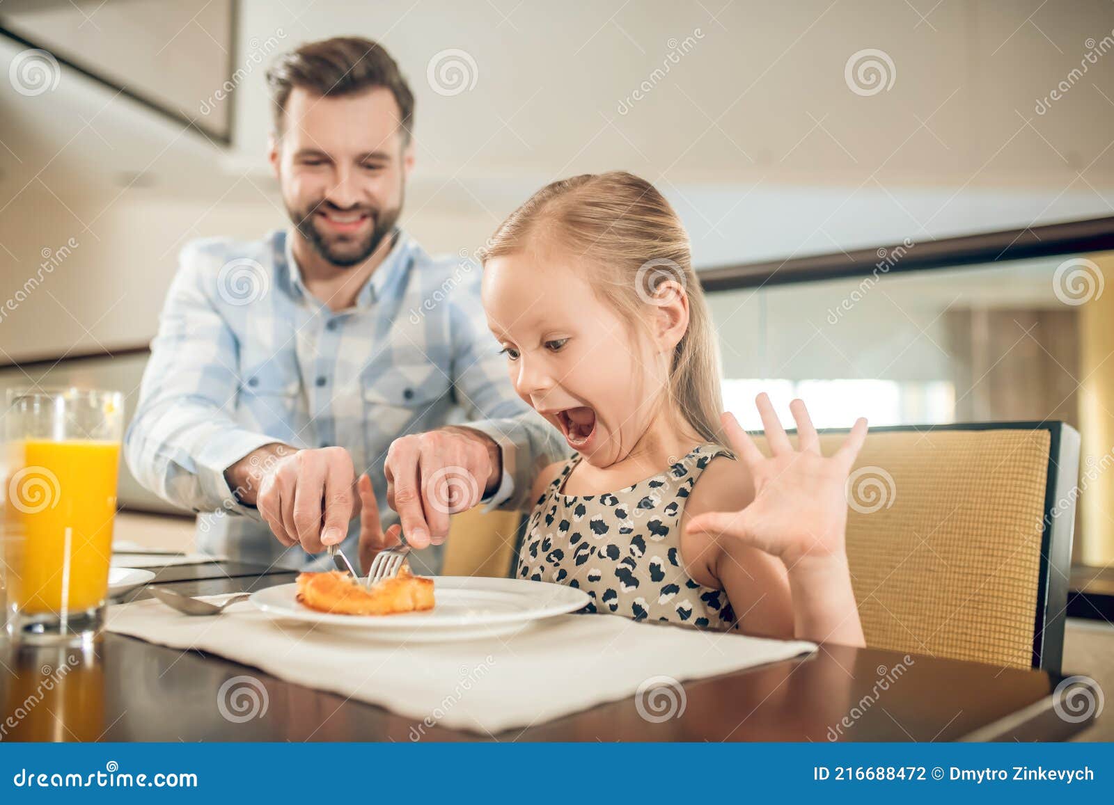 A Cute Girl Having Breakfast with Her Dad Stock Photo - Image of joyful ...