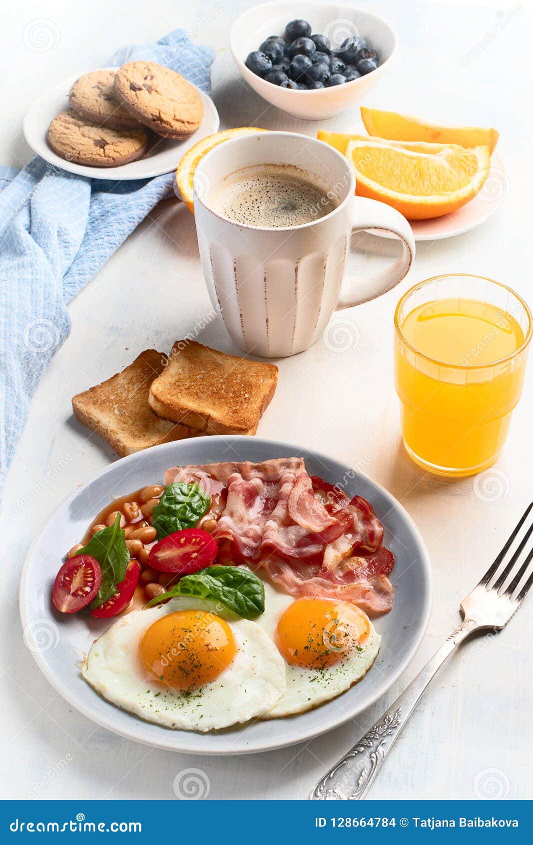 Breakfast with Fried Eggs, Bacon, Orange Juice, Yogurt and Toast Stock ... Breakfast with Fried Eggs, Bacon, Orange Juice, Yogurt and Toast Stock ...