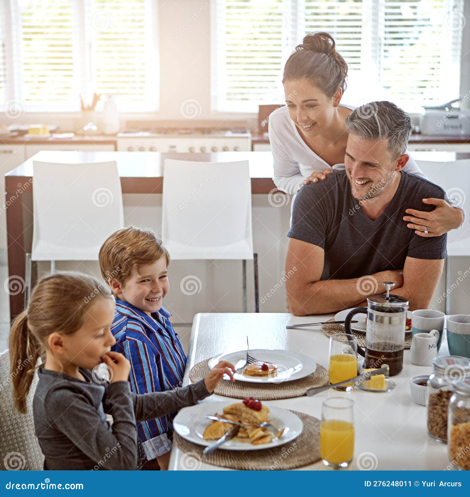 Breakfast Isnt Complete without Pancakes. a Family Having Breakfast ...