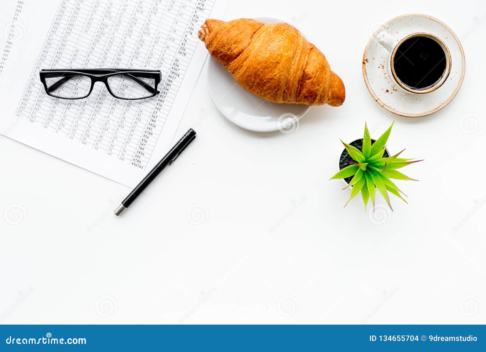 Breakfast in Office with Croissant and Coffee on the Work Desk with ...
