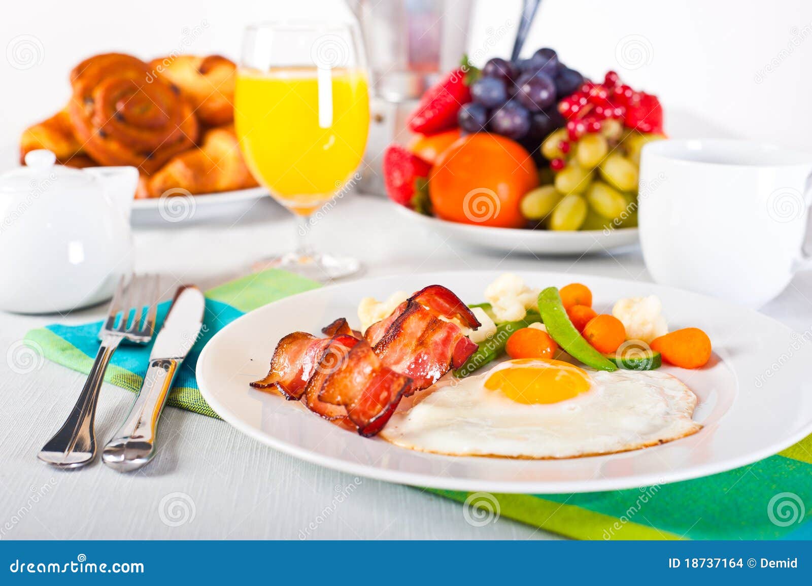 Breakfast table stock photo. Image of glassware, dishware - 18737164