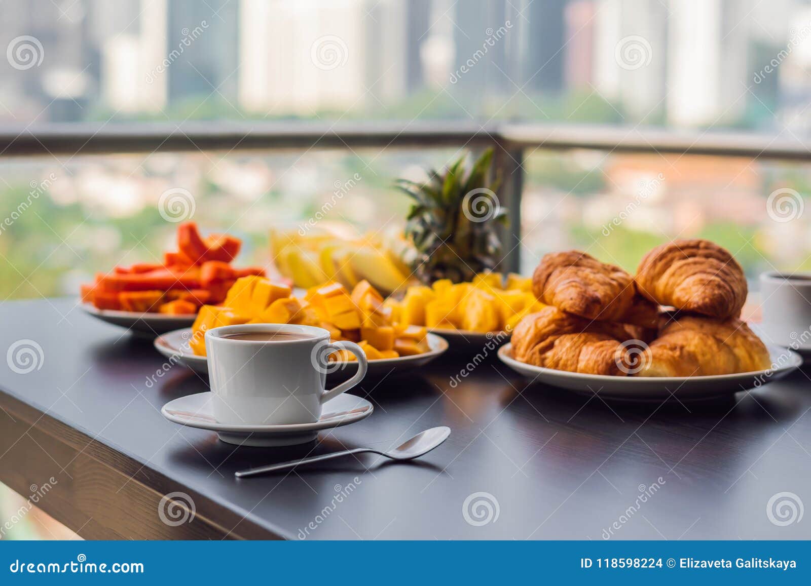Breakfast Table with Coffee Fruit and Bread Croisant on a Balcony ...