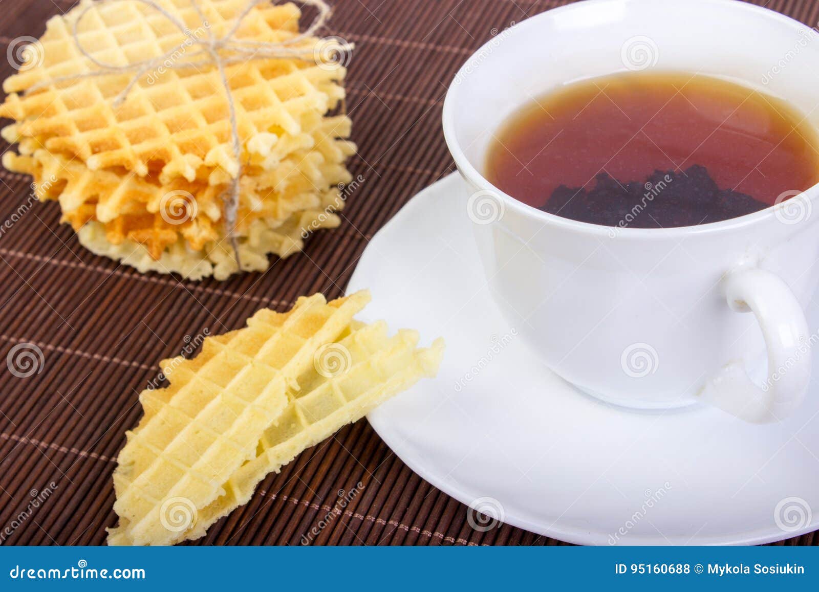 Breakfast with Waffles, Pieces of Waffle and Black Cup of Tea on Wooden ...