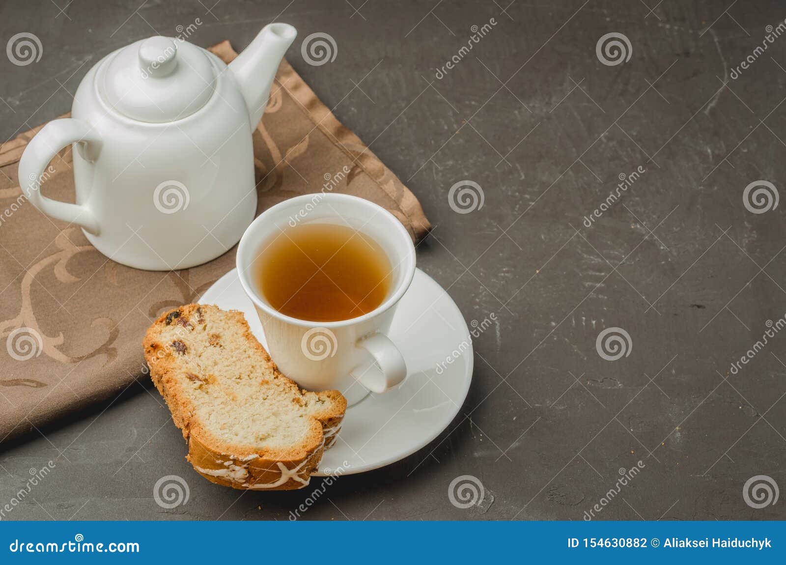 Breakfast with White Tea Cup and Teapot with a Pastries Piece on Dark ...