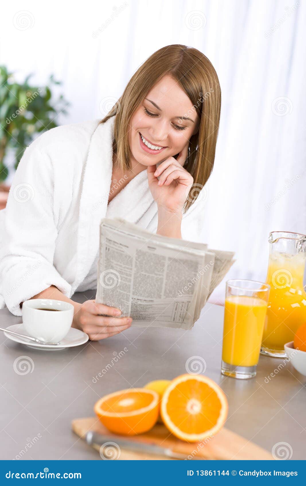 Breakfast - Woman Reading Newspaper in Kitchen Stock Photo - Image of ...