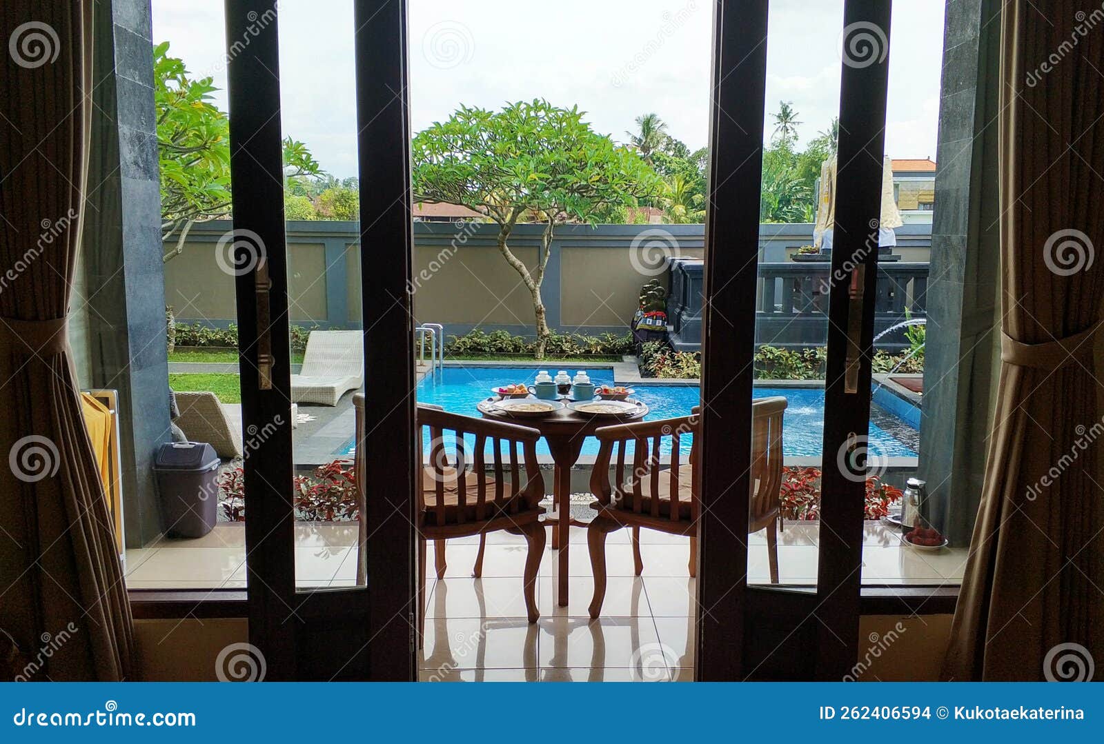 Breakfast on a Wooden Table on the Veranda by the Pool on Bali Island ...