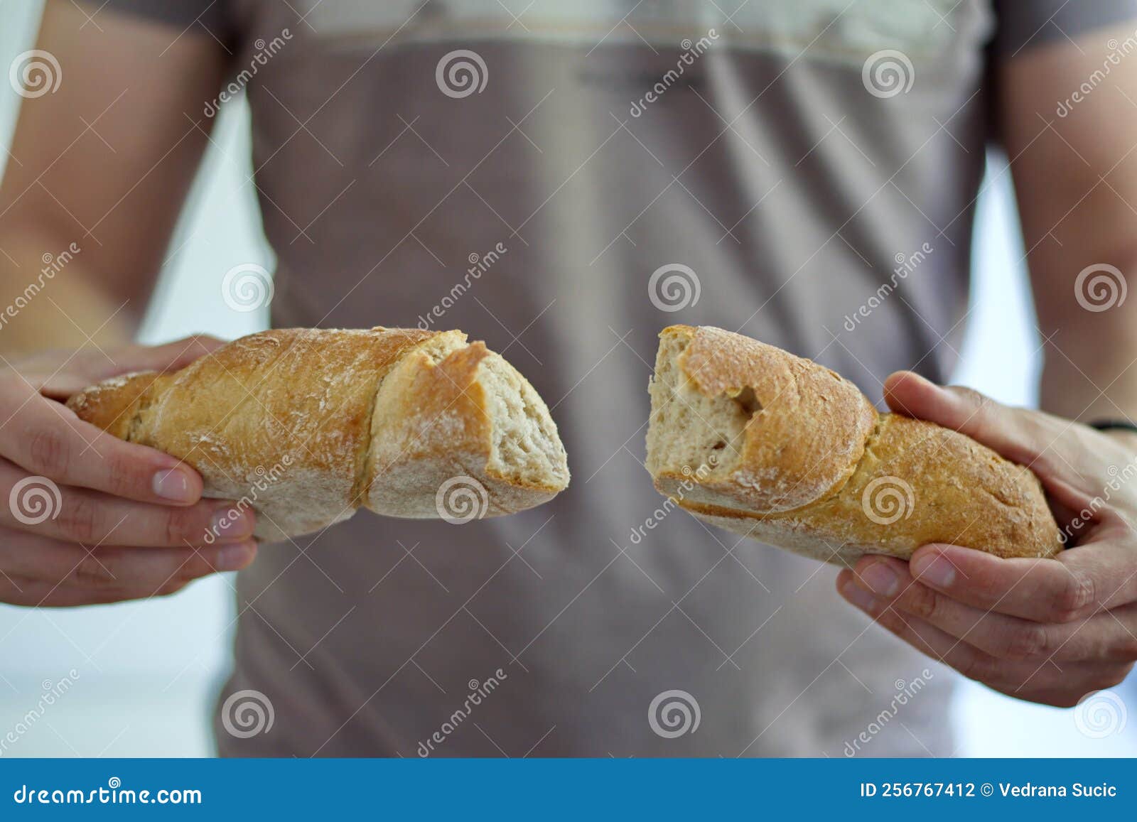 Breaking Baked Bread Loaf in Half Stock Photo - Image of flour, finger ...