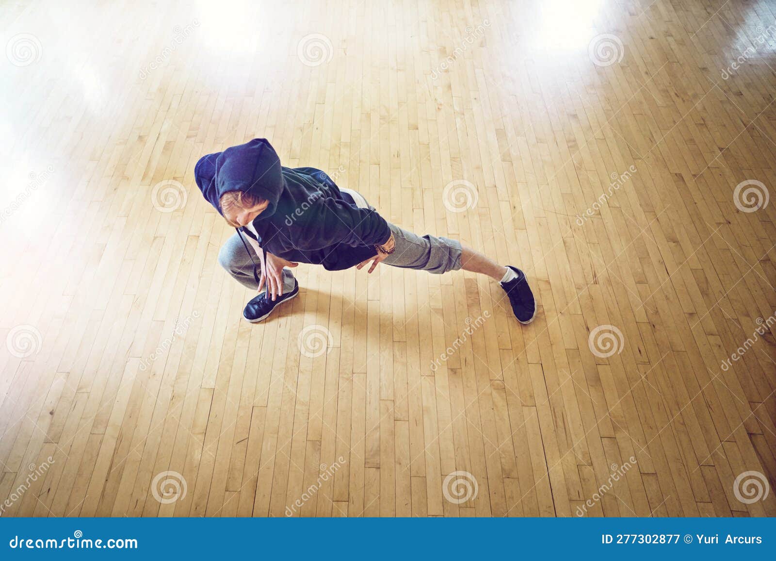 Breaking it Down. High Angle Shot of a Young Man Breakdancing in a ...