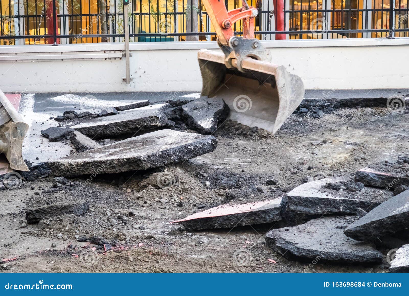 Breaking out asphalt stock photo. Image of industry - 163698684