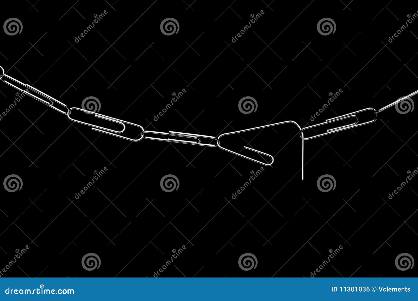 Breaking Paperclip Chain on Black Stock Photo - Image of paperclip ...