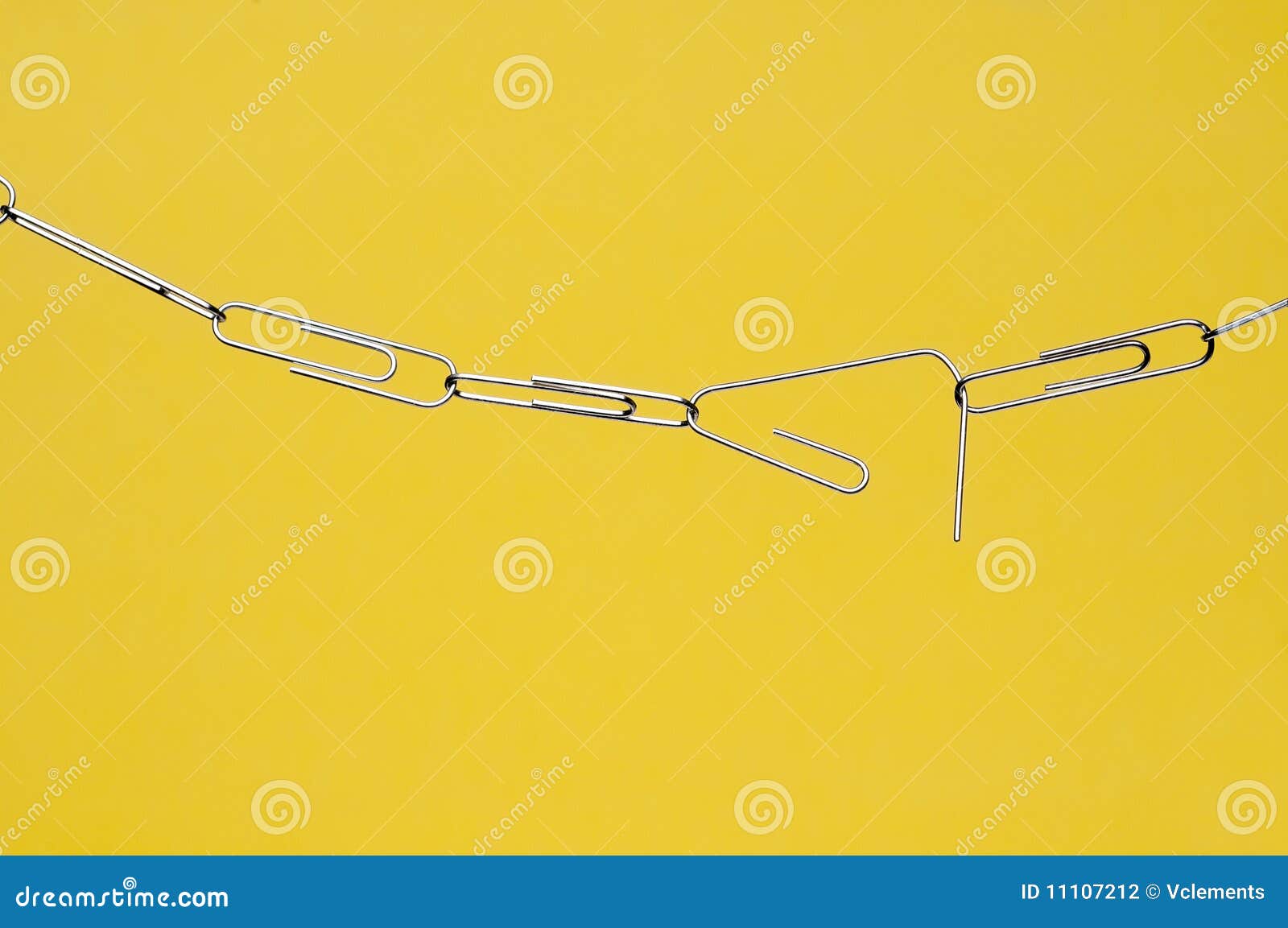 Breaking Paperclip Chain on Yellow Stock Photo - Image of link, steel ...