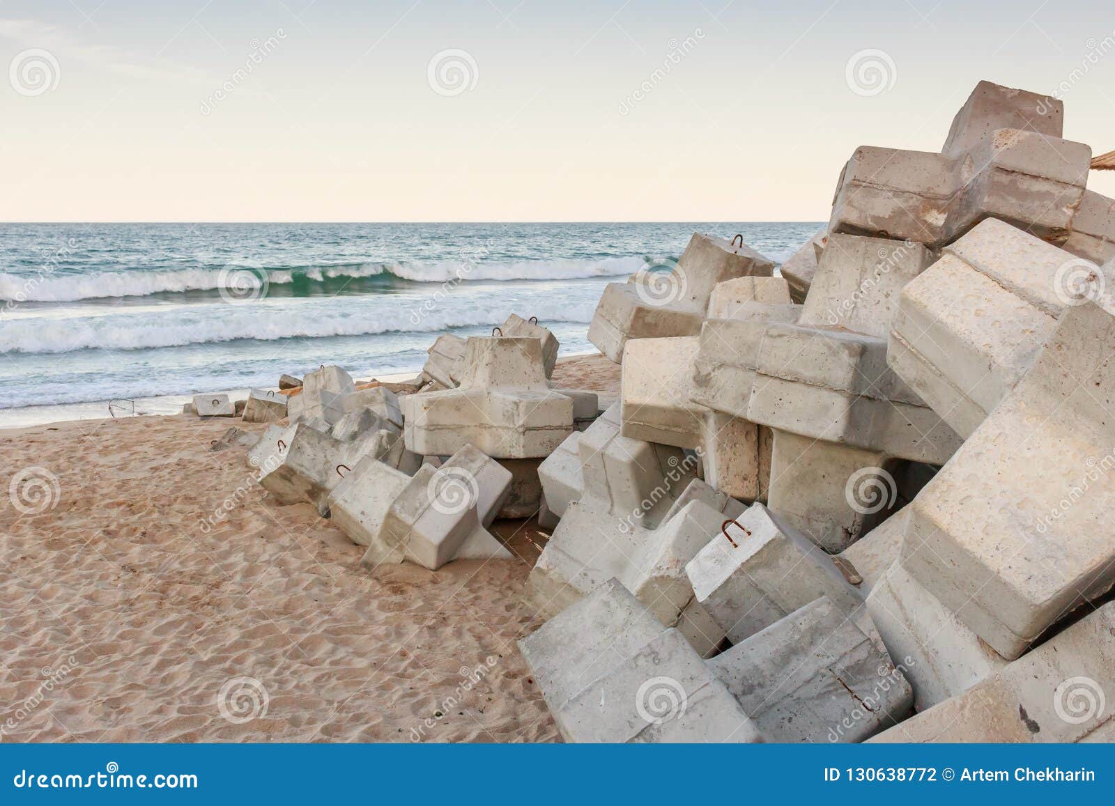 Breakwater with Concrete Blocks on Sand Beach, Sunset Stock Photo ...