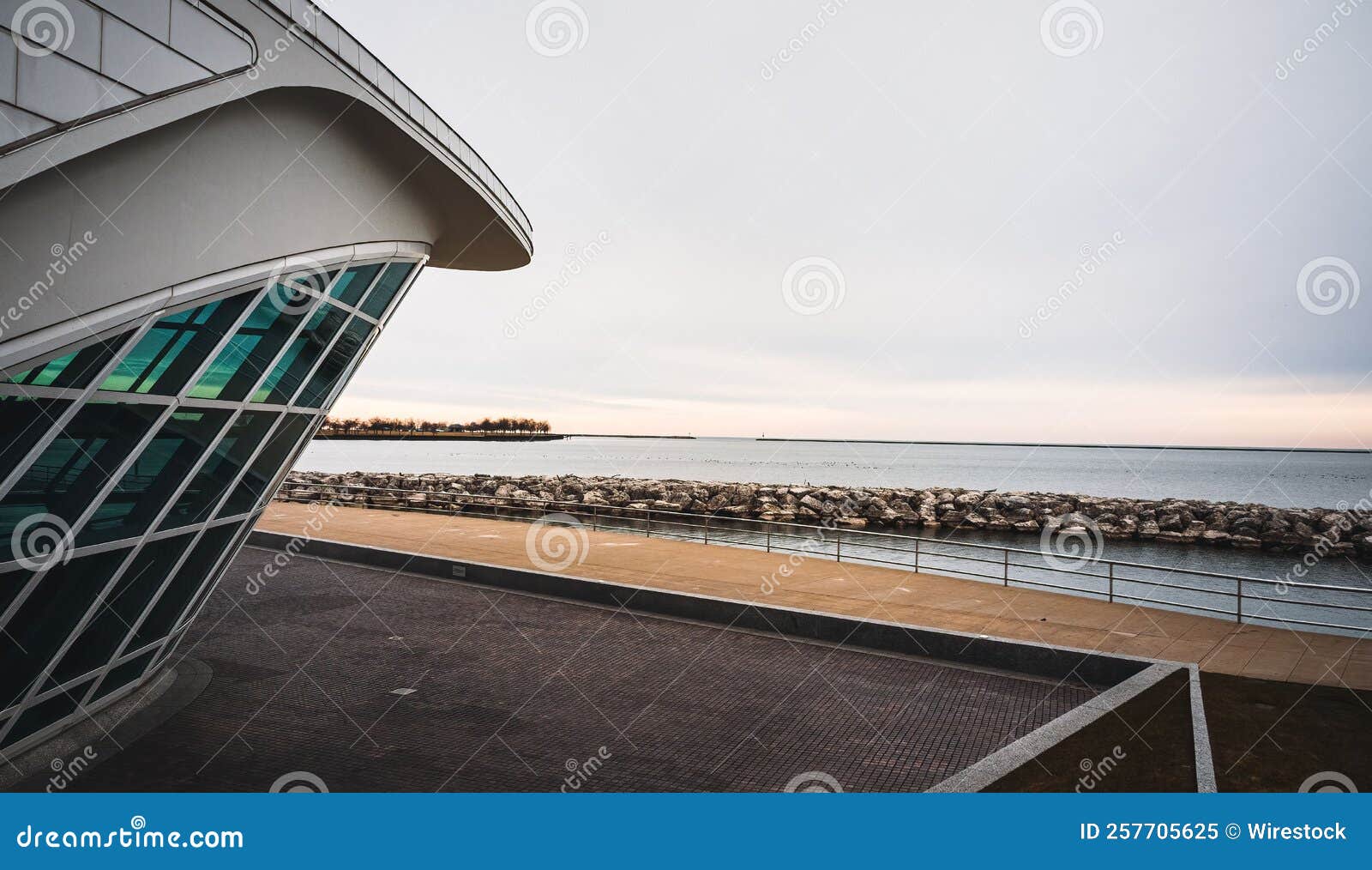Breakwater and a Modern Building Facing the Horizon Editorial Image ...