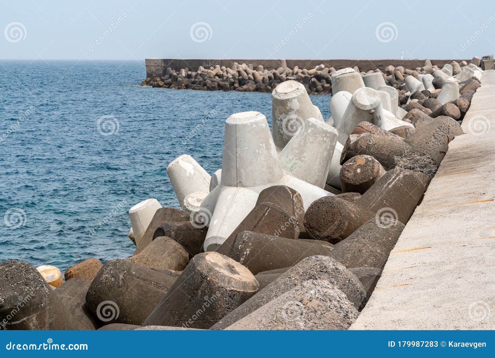 Breakwater Protection Under Blue Sky, Solid Concrete Blocks in Port of ...
