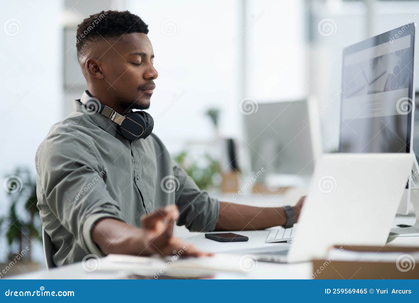 Breathe in , Breathe Out. a Young Man Meditating in at Work. Stock ...