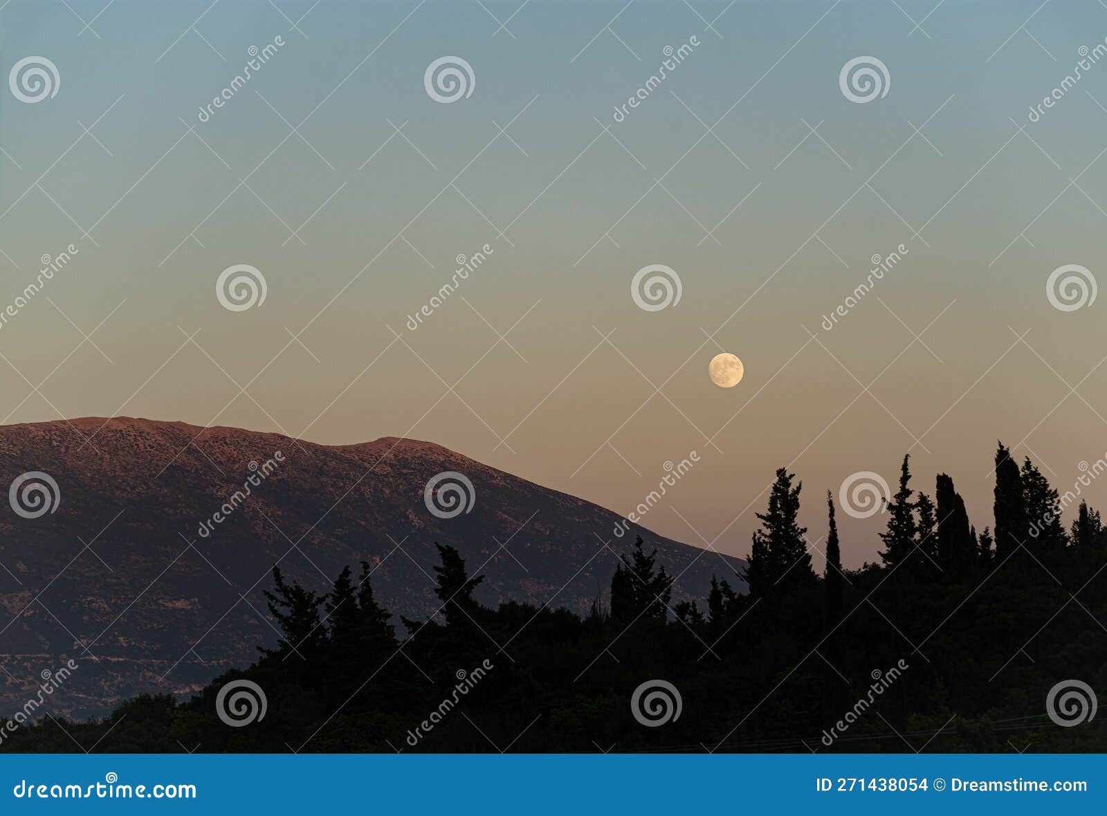 Breathtaking Image of a Full Moon Set Amongst a Mountainous and Tree ...