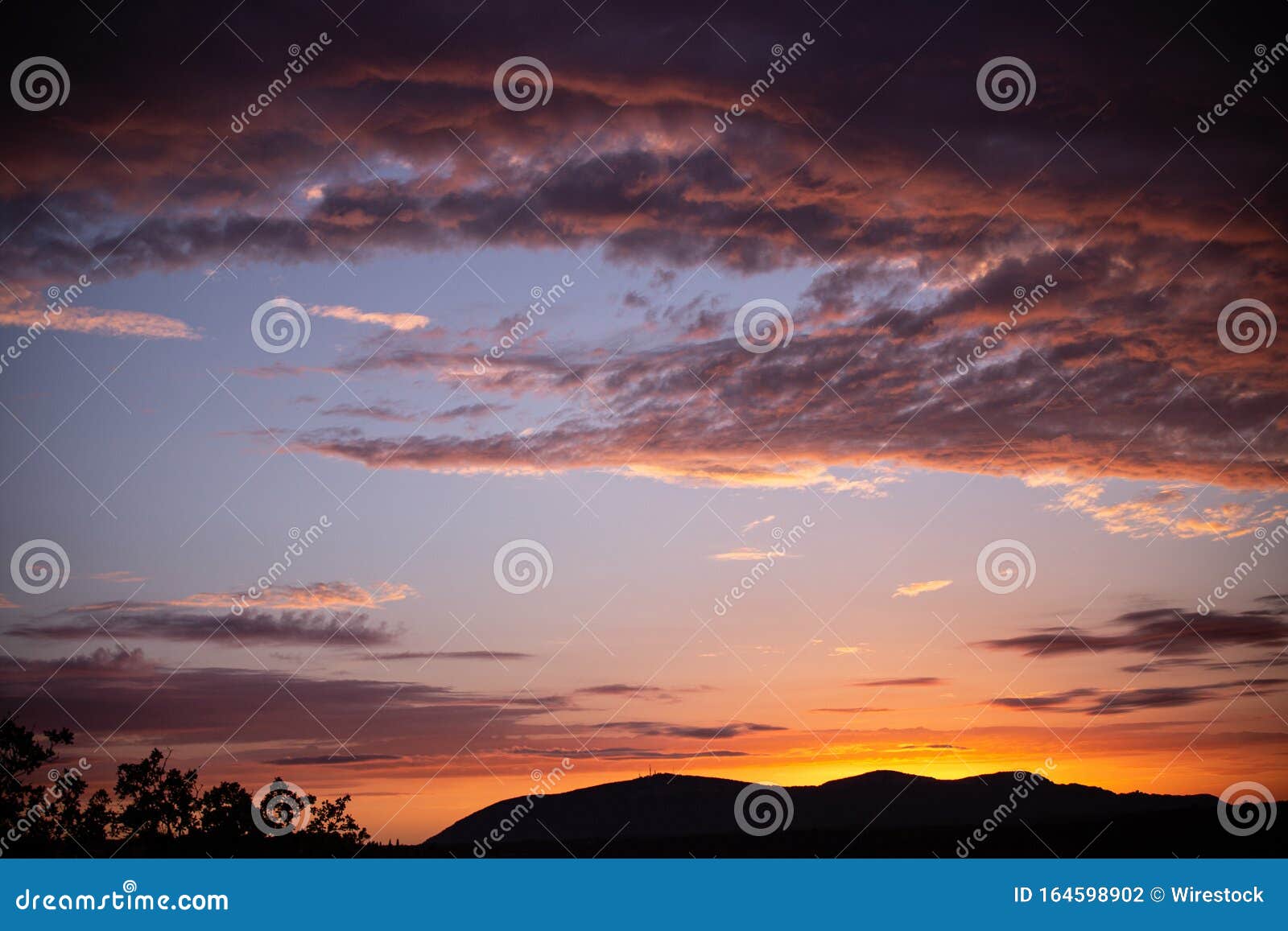 Breathtaking Shot of a Beautiful Sunset with Unique Colors in the ...