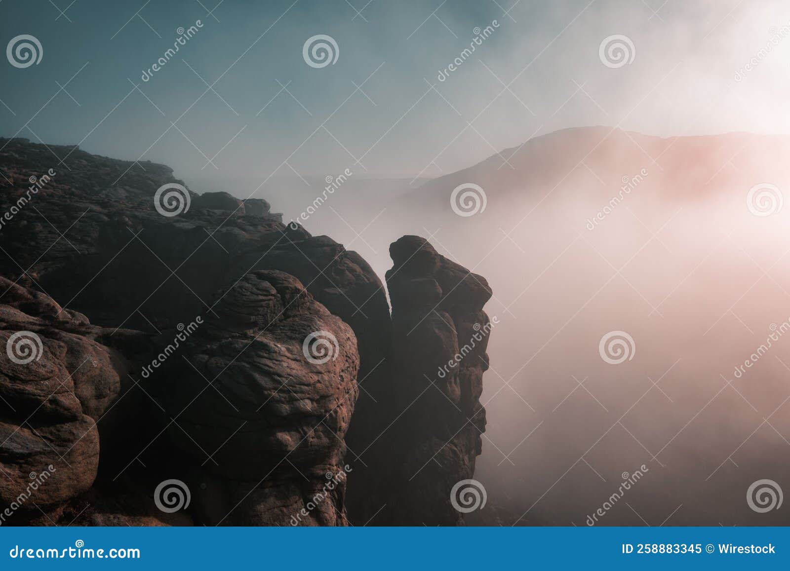 Breathtaking View of the Edge of a Huge Cliff Surrounded by Clouds ...