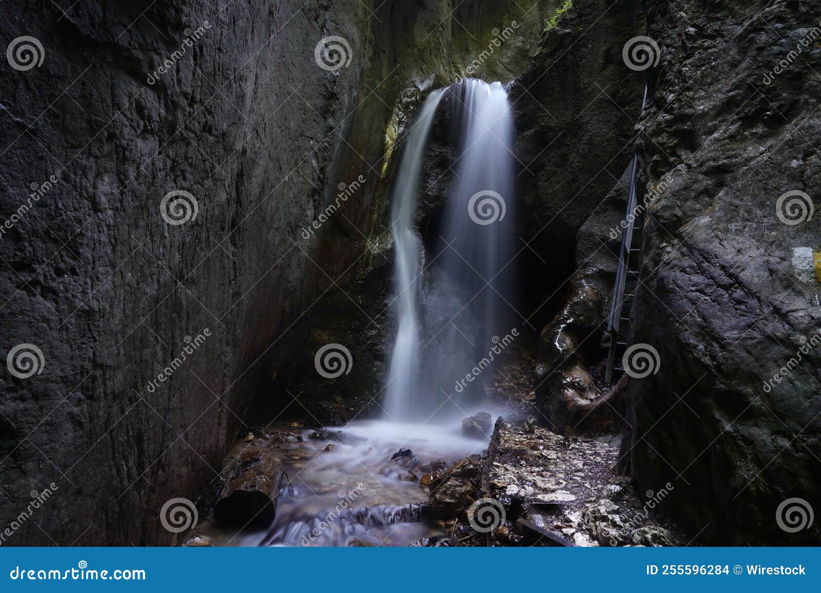 Breathtaking View of a Waterfall between Rocks in Gorge with Narrow ...