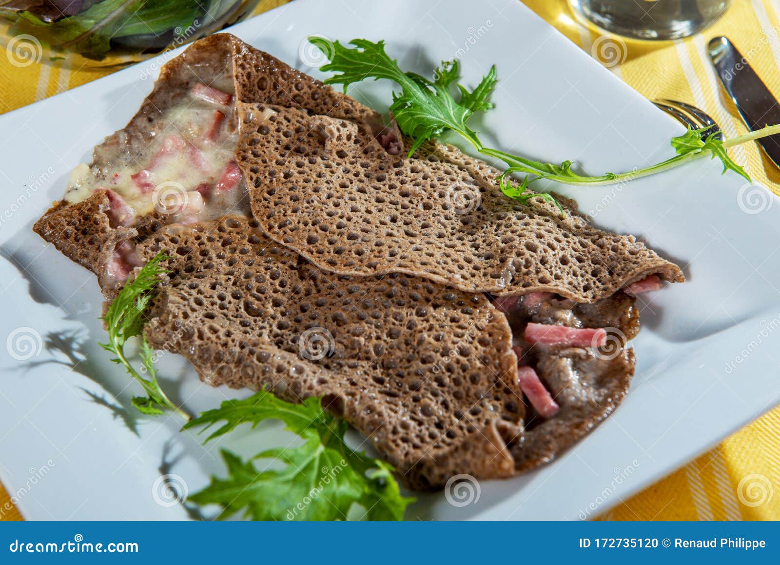 Breton Crepe with Cheese and Bacon in White Plate Stock Photo - Image ...