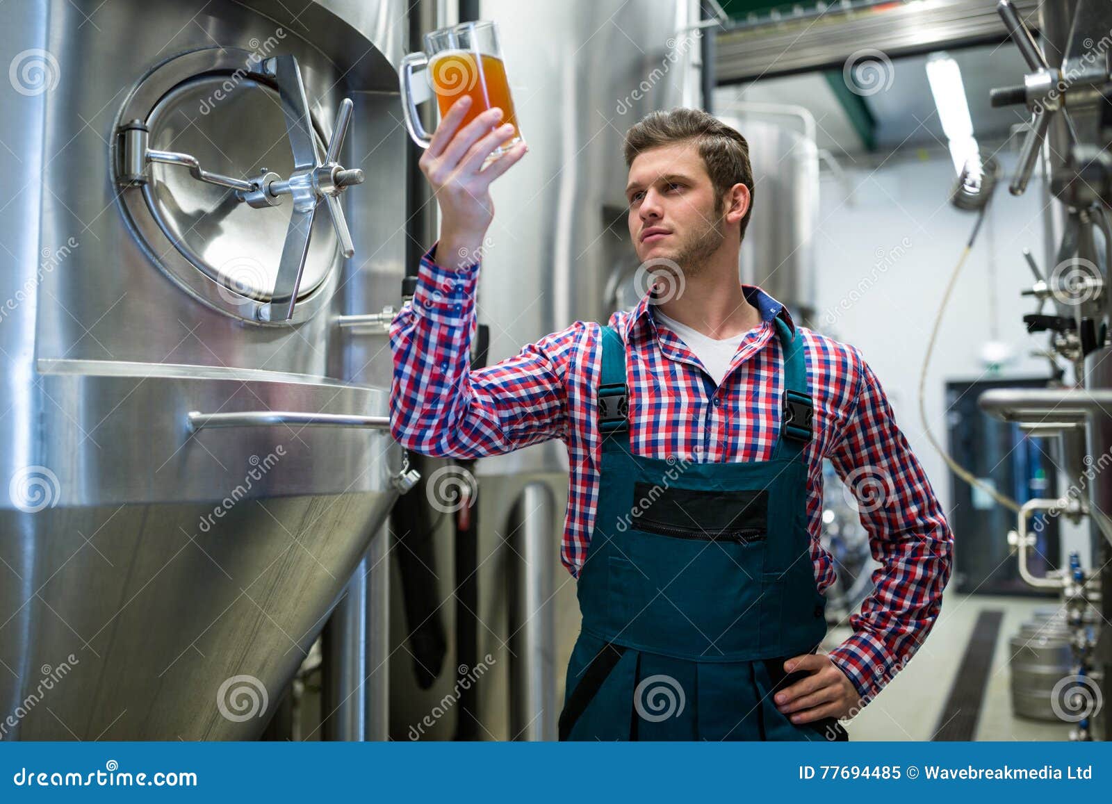 Brewer testing beer stock image. Image of distillery - 77694485