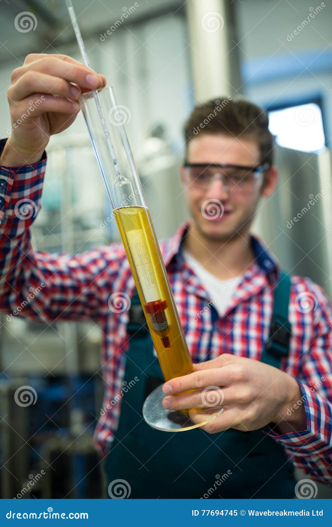 Brewer testing beer stock image. Image of examining, concentration ...
