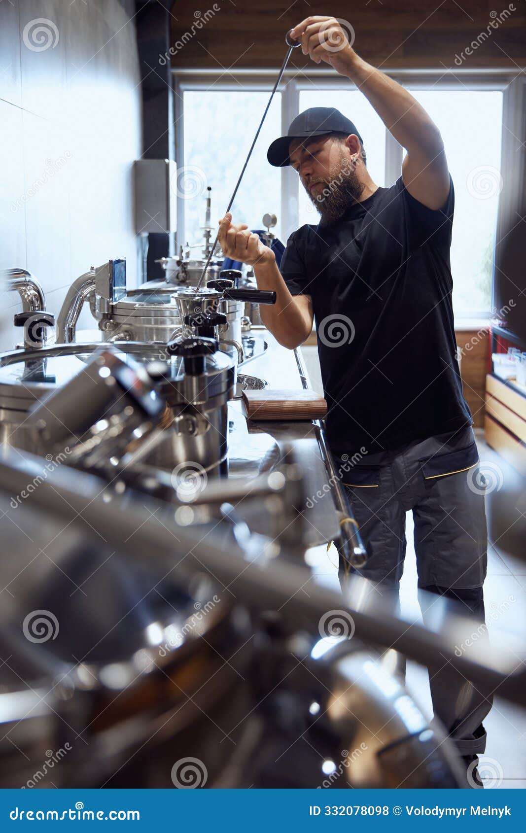 Brewery Technologist Examining Equipment in Brewing Process, Checking ...