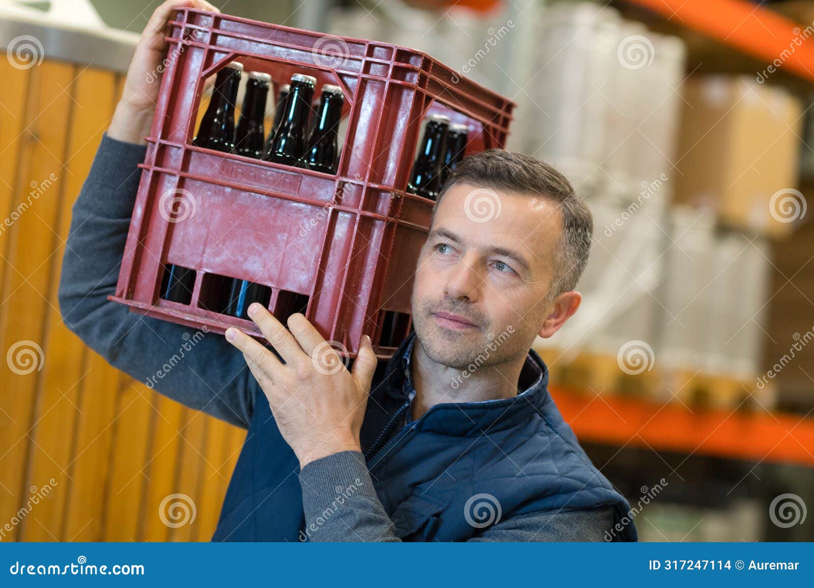 Brewery Worker Carrying Beer Bottles Stock Photo - Image of pack ...