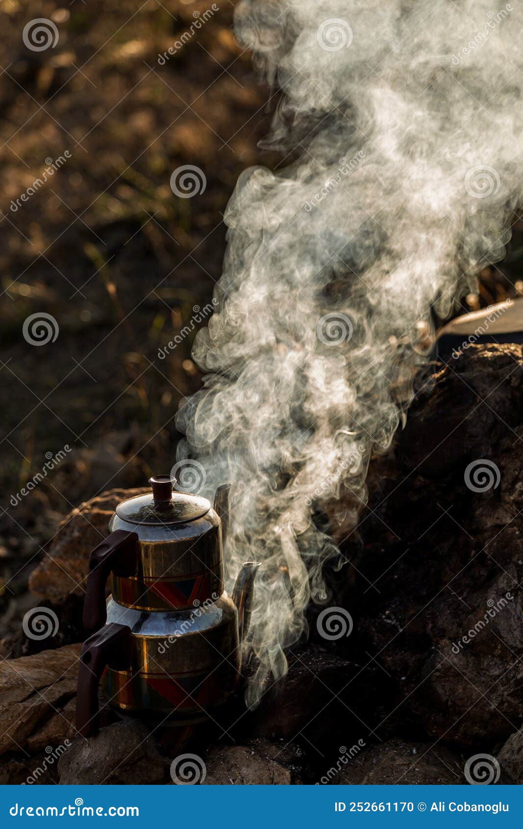 Brewing Tea on a Campfire and Smoke from the Fire Stock Photo - Image ...