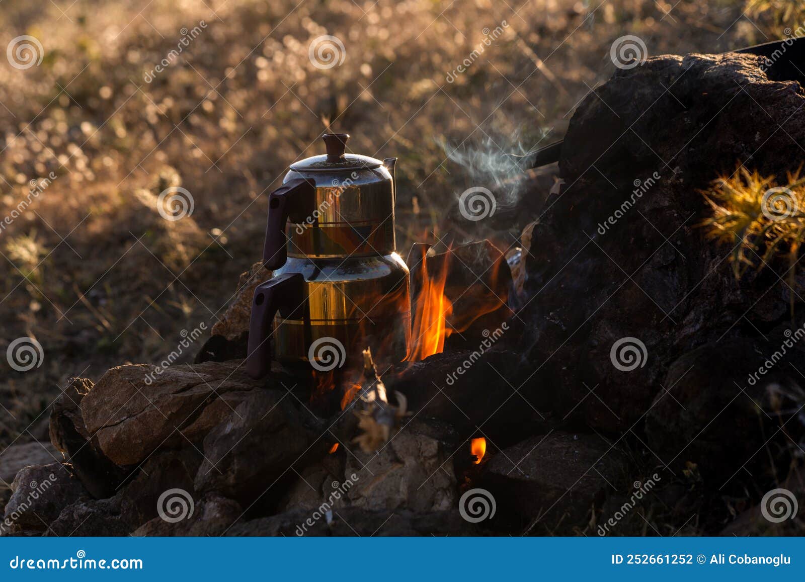 Brewing Tea on a Campfire and Smoke from the Fire Stock Photo - Image ...