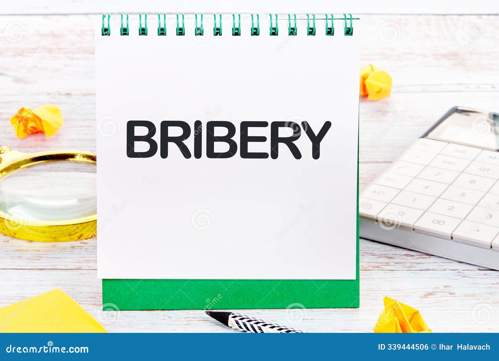 BRIBERY Word Written on a Blank Sheet of a Desktop Notebook Stock Photo ...
