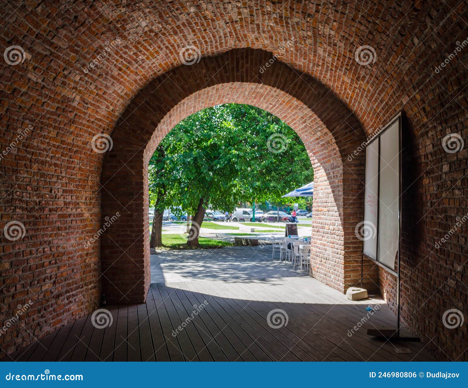 A Brick Arch with a Green Tree Behind it....IMAGE Stock Photo - Image ...