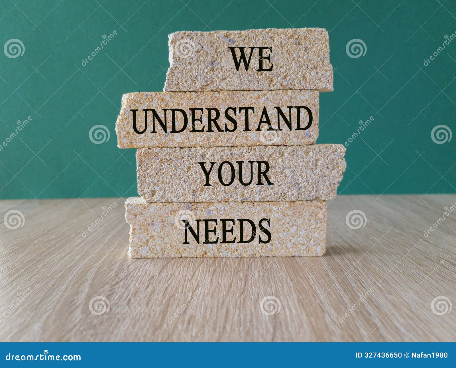 Brick Blocks with we UNDERSTAND YOUR NEEDS Text on Beautiful Green ...