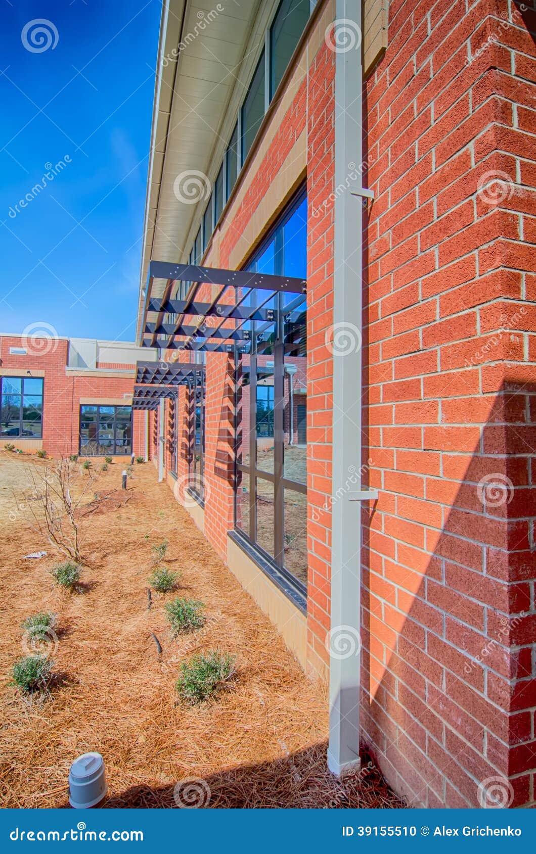 Brick Building Architecture with Suncreen Shades Stock Photo - Image of ...