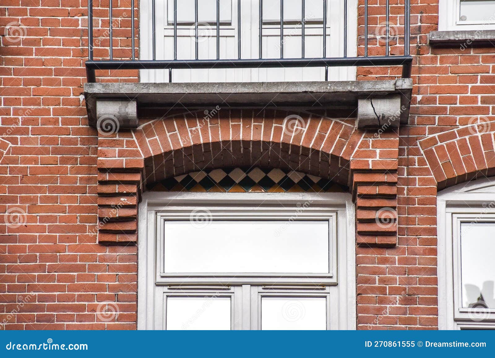 A Brick Building with a Window and a Balcony Editorial Image - Image of ...