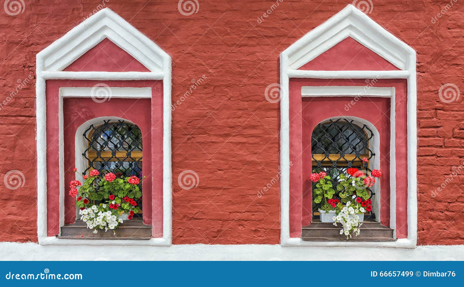 Brick Building Decorated with Flowers Geraniums Stock Image - Image of ...