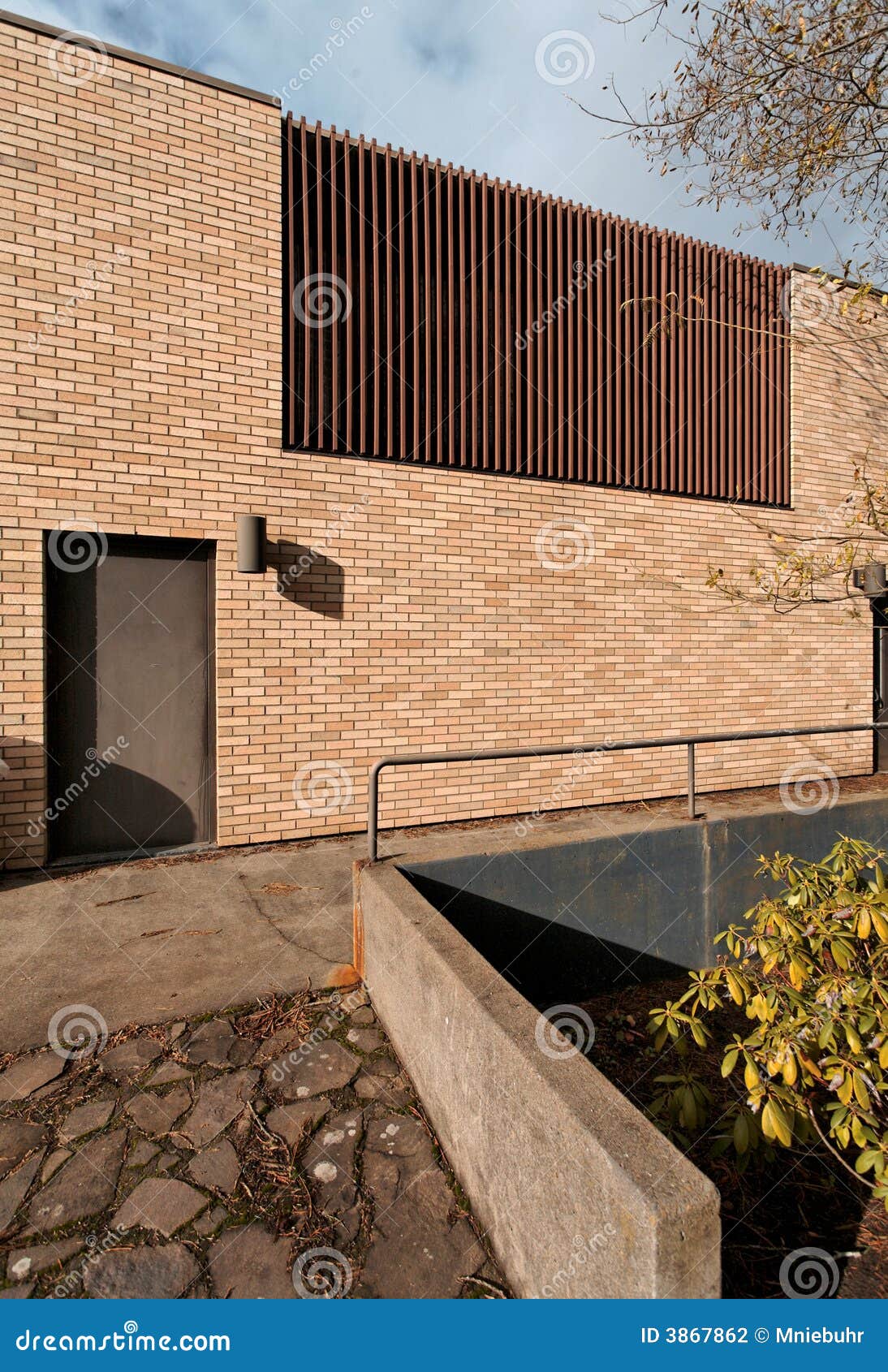 Brick Building Exterior with Vertical Wood Grille Stock Photo - Image ...