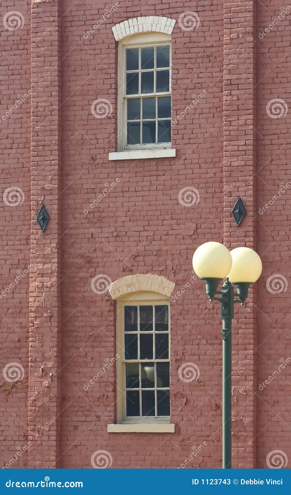 Brick Building with Lamp Post Stock Image - Image of light, globe: 1123743