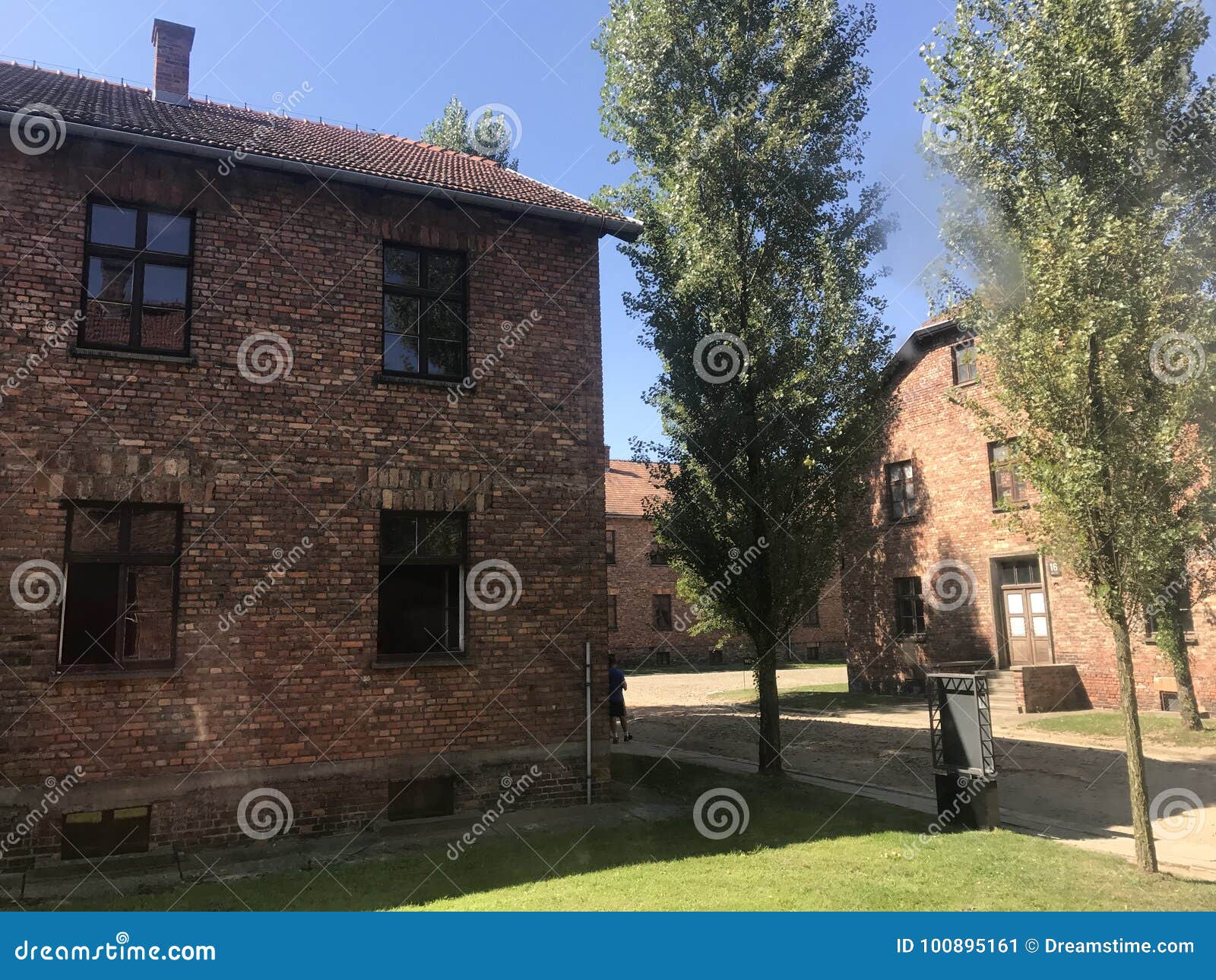 Brick buildings and trees editorial photo. Image of outdoor - 100895161